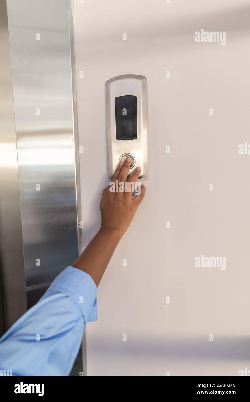 Female finger pressing elevator button Stock Photo - Alamy