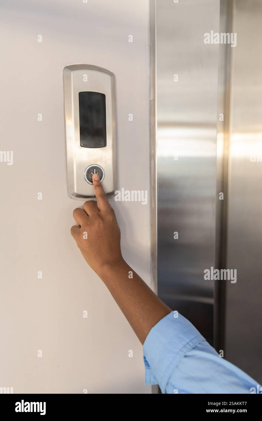 Female finger pressing elevator button Stock Photo - Alamy