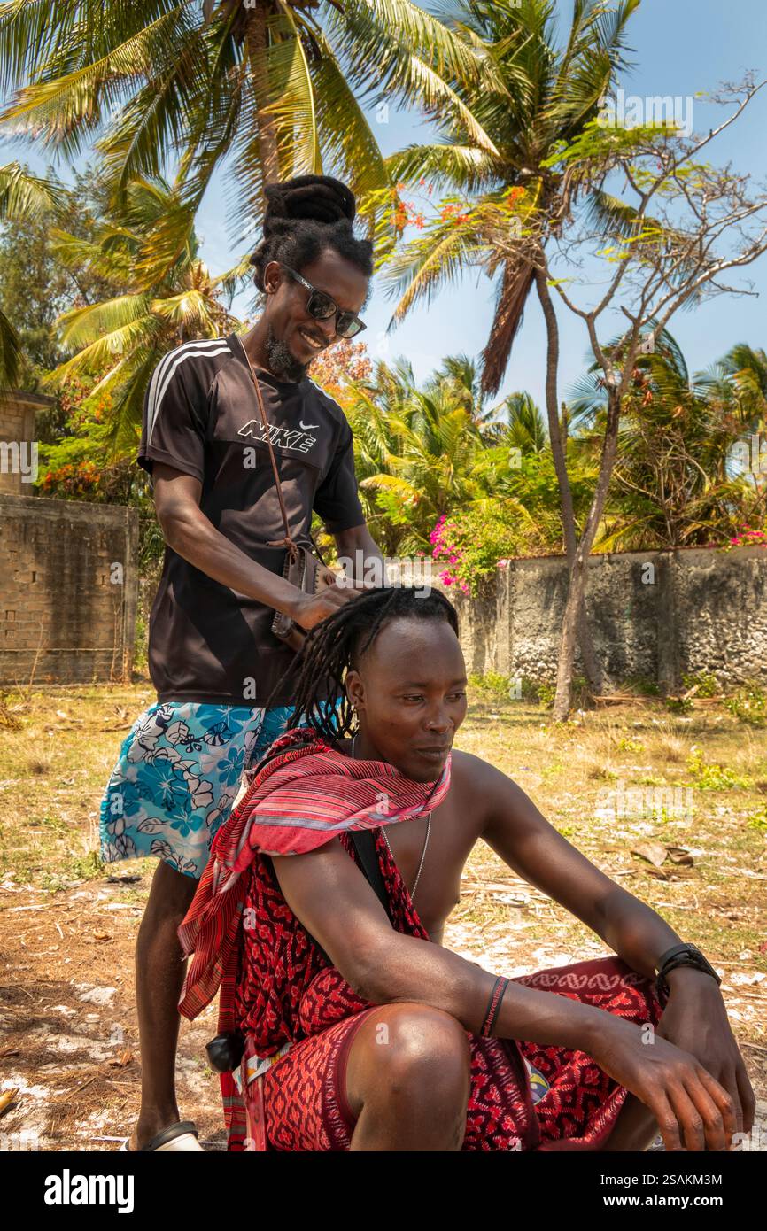 Africa Tanzania, Zanzibar, East Coast, Dongwe, Maasai man having hair ...