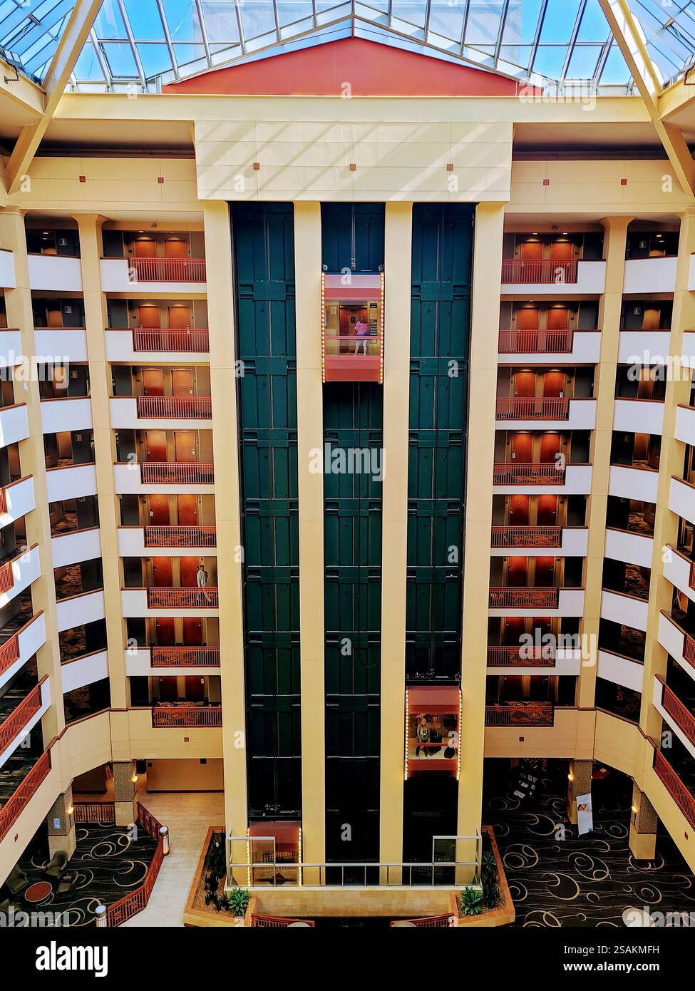 Glass Elevator and Balconies in Modern Hotel Atrium Aerial Stock Photo ...