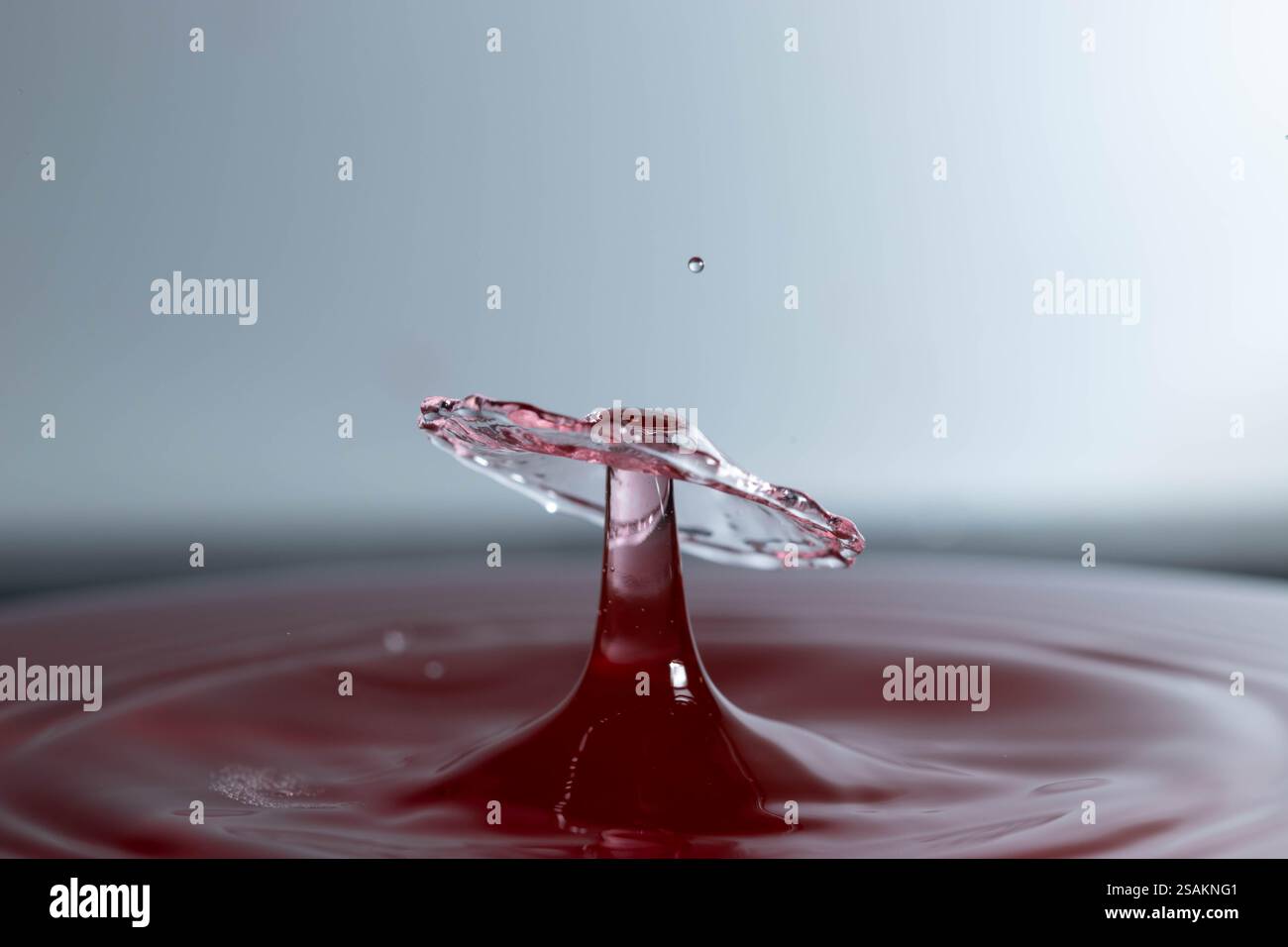 Red collision splashart droplets Stock Photo - Alamy