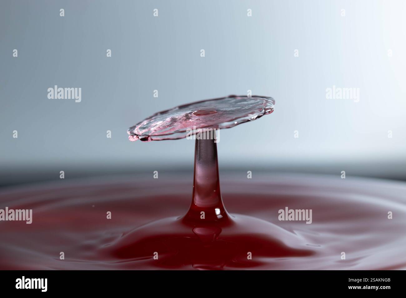 Red collision splashart droplets Stock Photo - Alamy