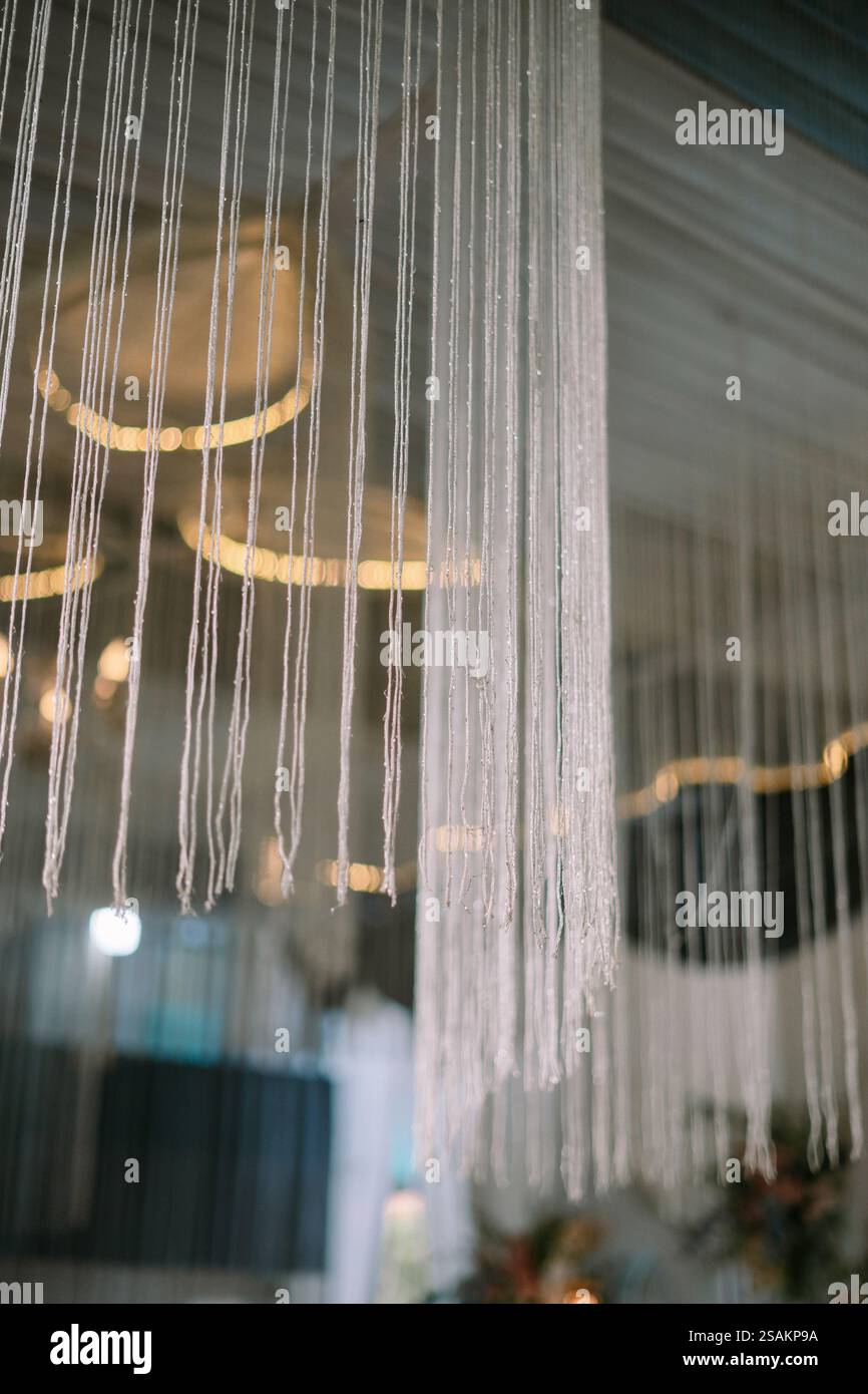Decorative ceiling installation with white drapes and lights Stock ...