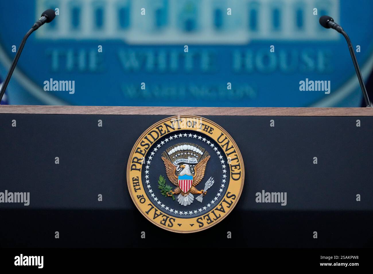 The presidential seal is placed on the podium of James Brady Press ...