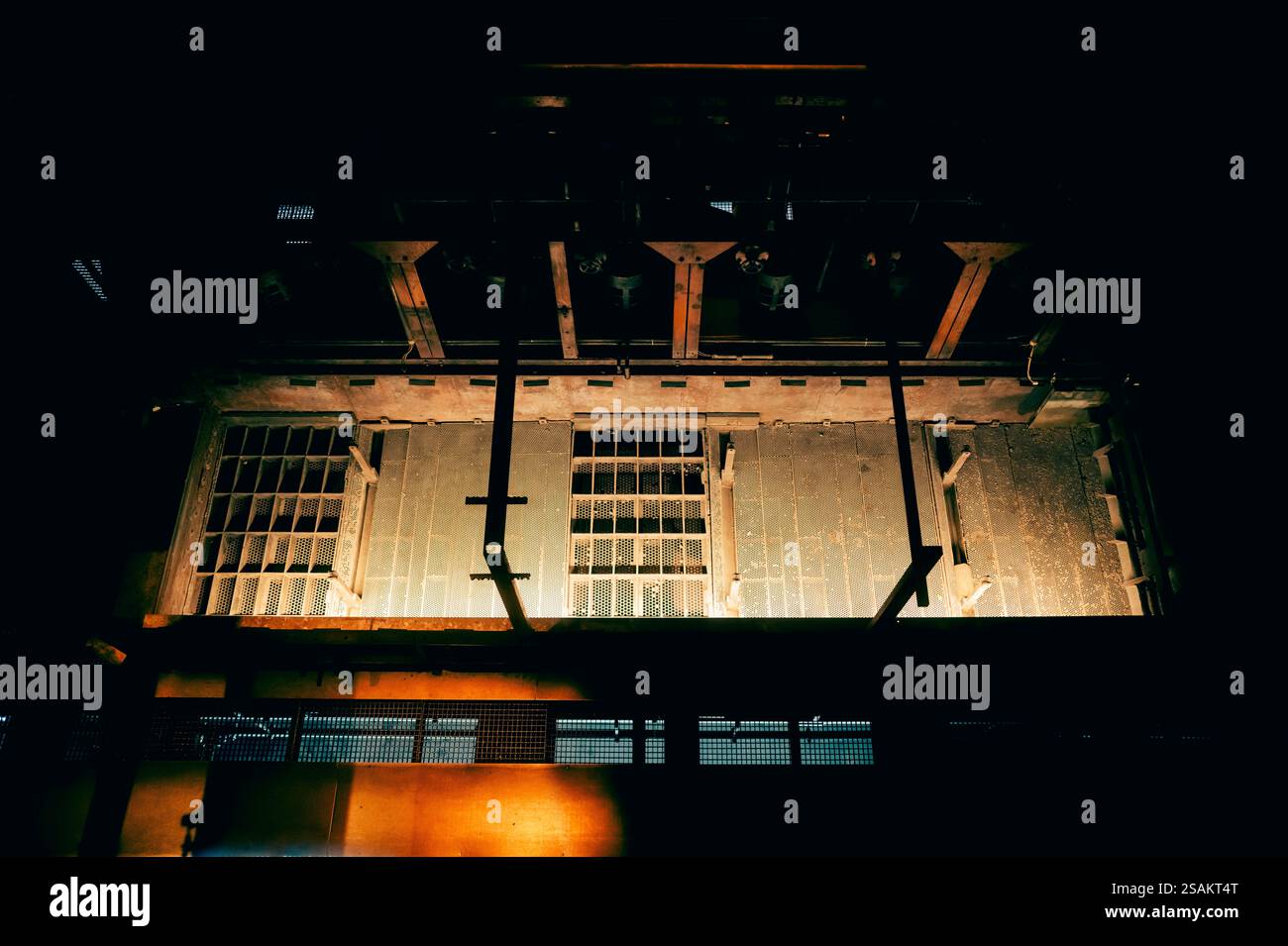 Industrial interior with gridded floors and structural beams ...