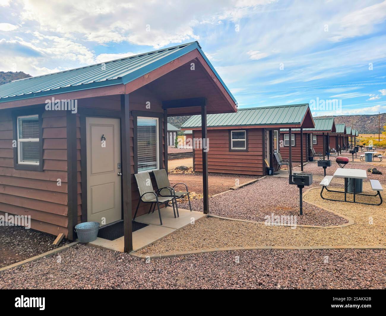 Rustic Cabins in Zion Retreat with Desert Backdrop Eye-Level View Stock ...