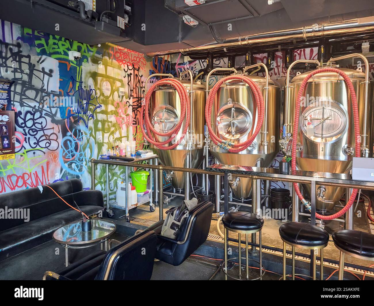 Modern Urban Brewery with Graffiti and Seating Eye Level View Stock ...