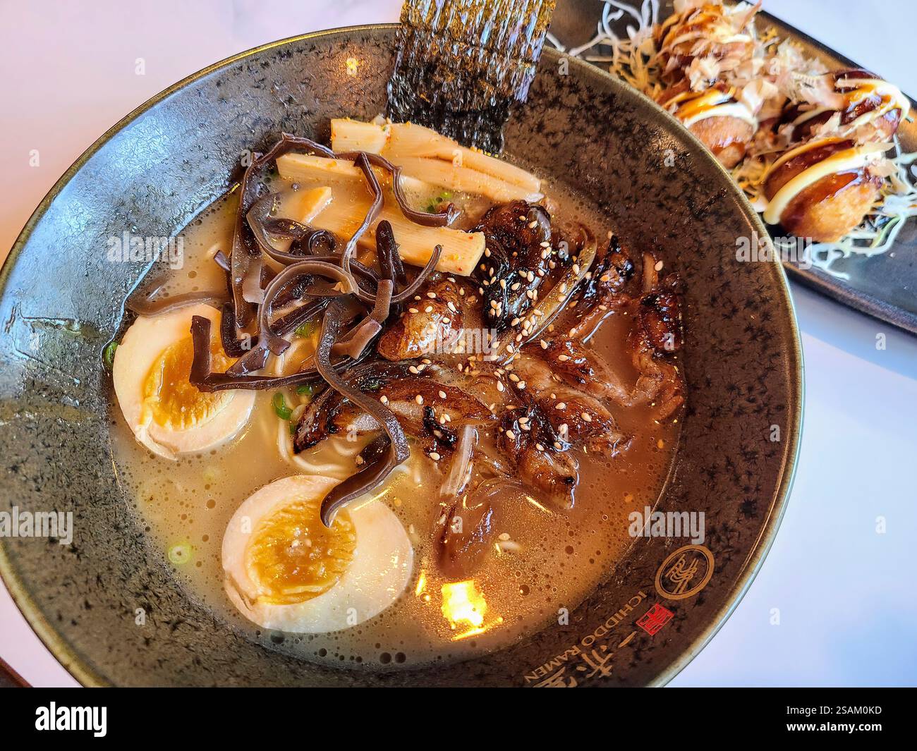 Gourmet Ramen and Takoyaki in Rustic Bowl Eye-Level View Stock Photo ...