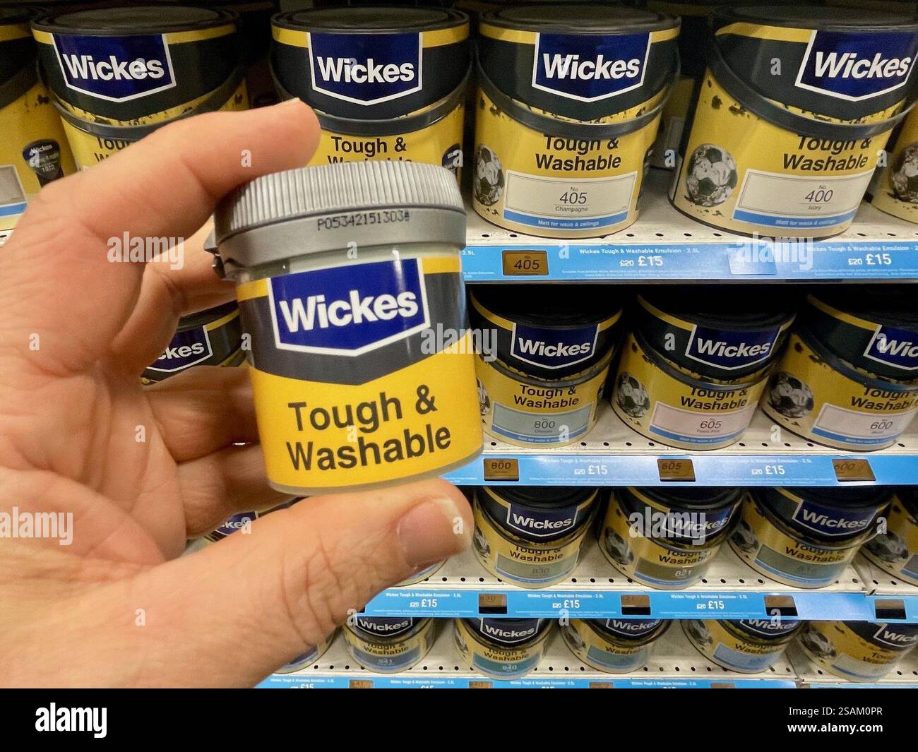 A general view of shelves with emulsion paint on display, inside Wickes ...