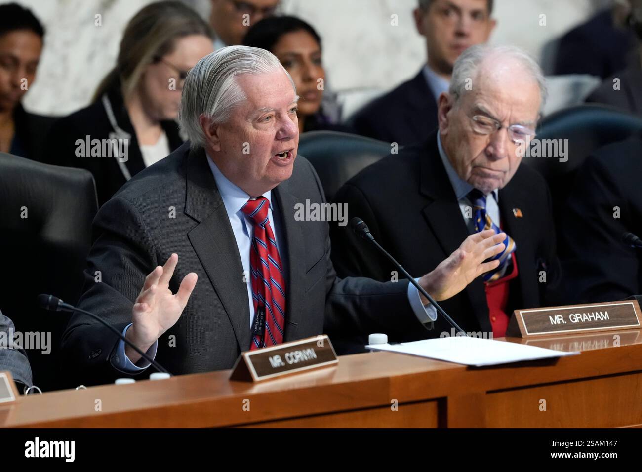 Sen. Lindsey Graham, R-S.C., speaks as Sen. Chuck Grassley, R-Iowa ...