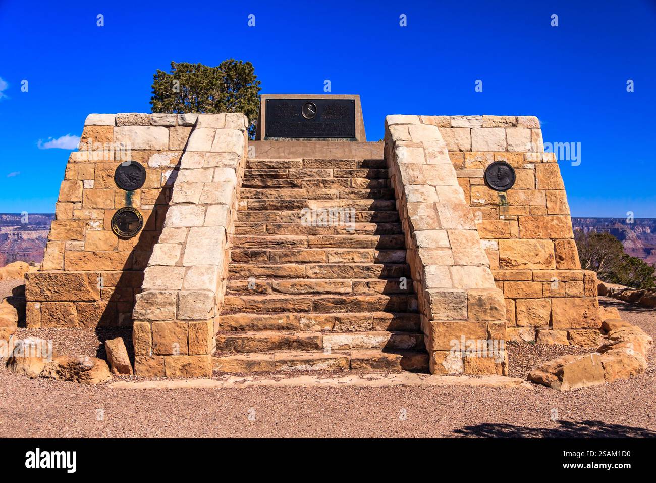 A stone staircase leads up to a monument. The monument is surrounded by ...