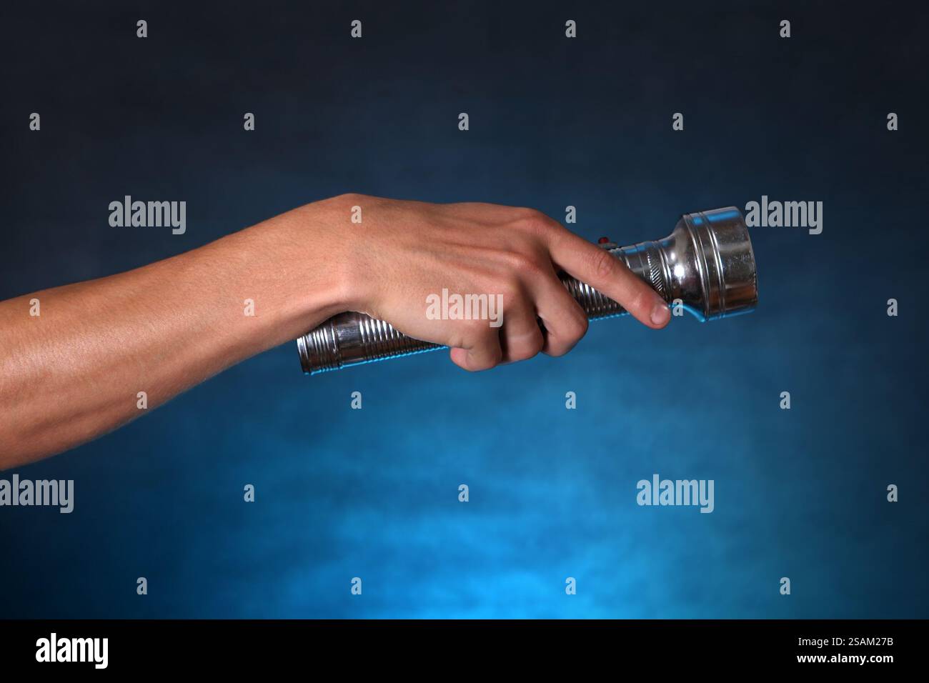 Hand with Flashlight on the dark background Stock Photo - Alamy