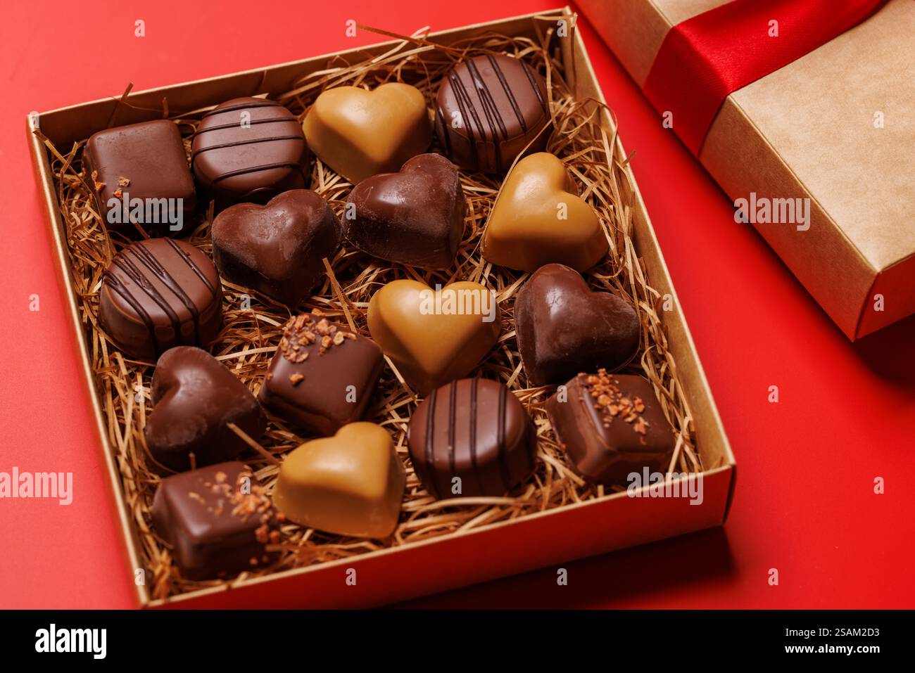 Valentines day box of rich chocolates, set against a romantic backdrop ...
