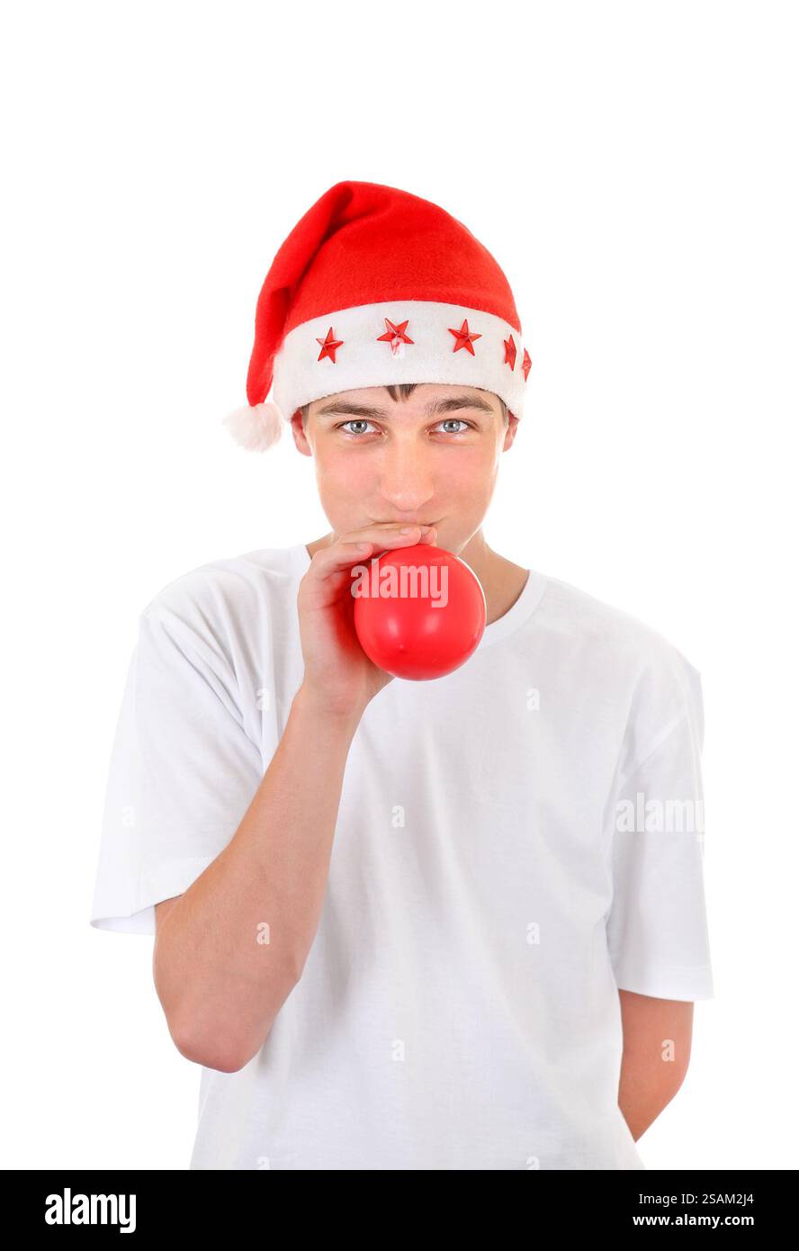 Teenager in Santa's Hat inflate Red Balloon Isolated On The White ...