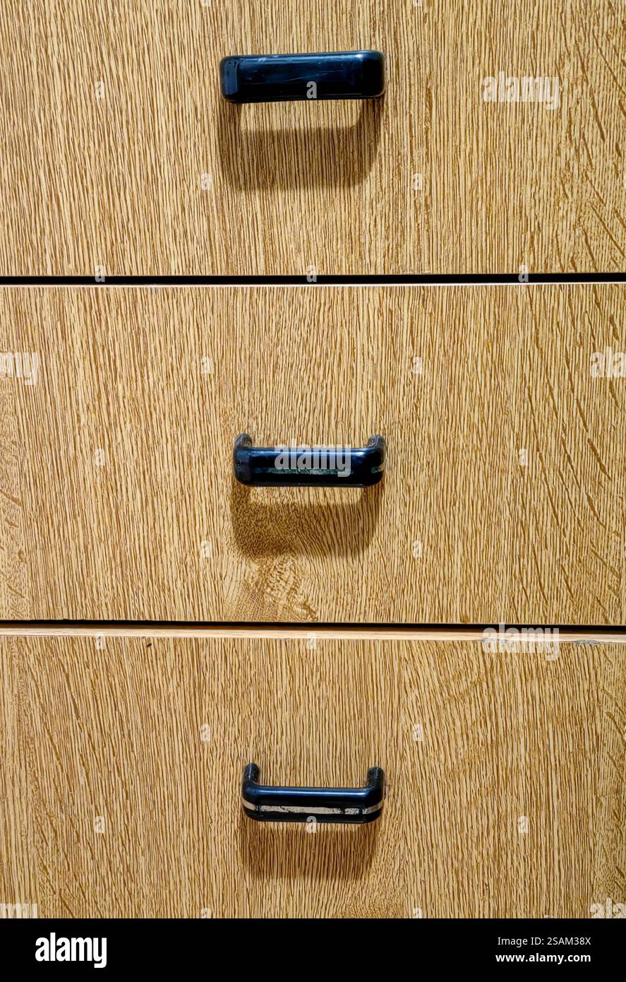 Symmetry in Simplicity: Wooden Desk Drawers with Black Handles Stock ...