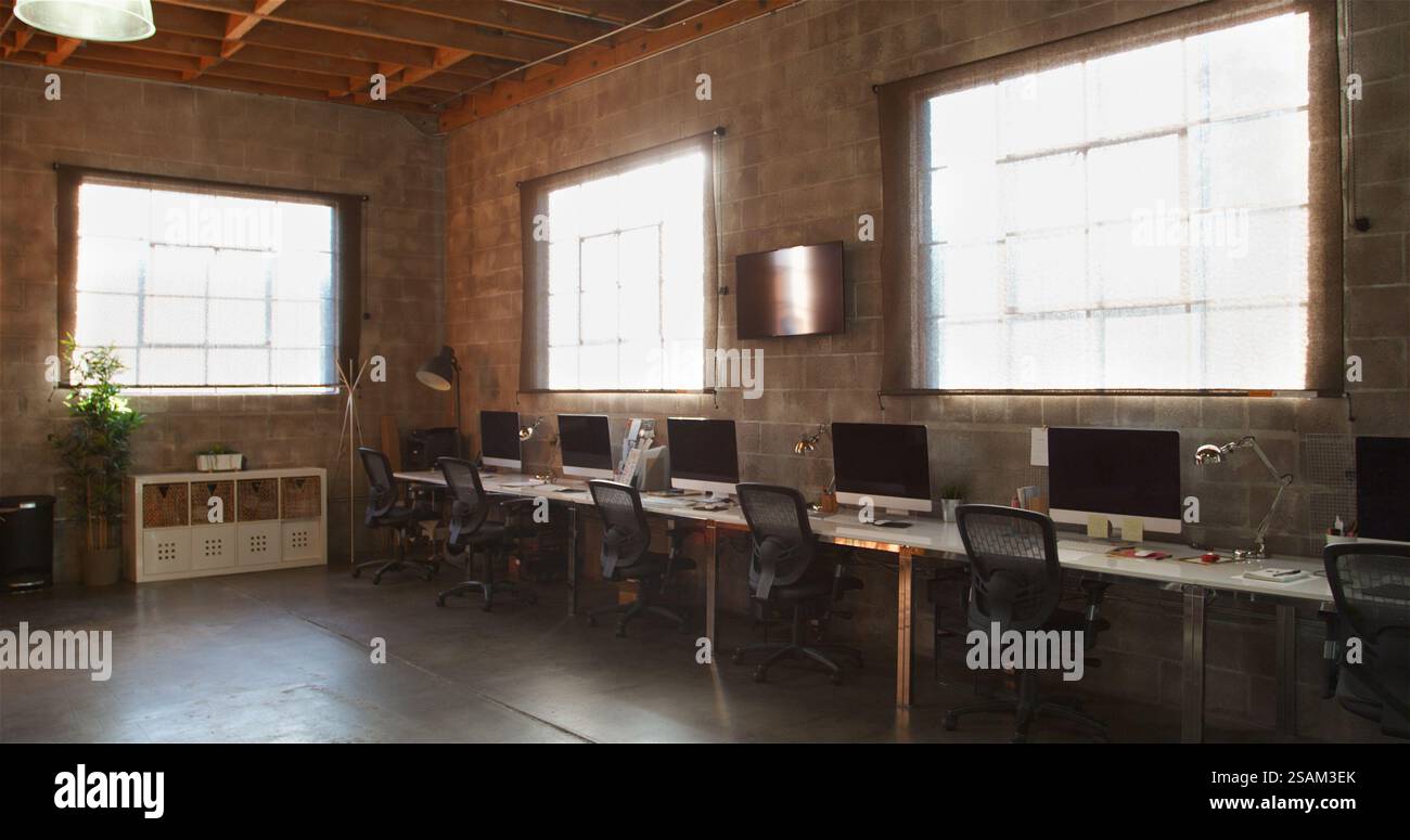 Empty Interior Of Modern Open Plan Design Office With Row Of Computers ...