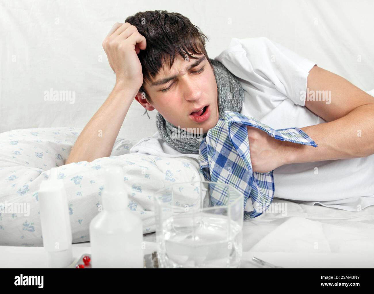 Young Man fell ill and Lying on the Bed with Handkerchief Stock Photo ...