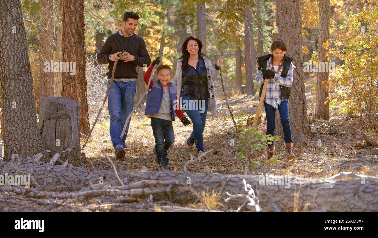 Active Family Outdoors Enjoying Autumn Or Fall Walk In Forest Together Stock Photo - Alamy