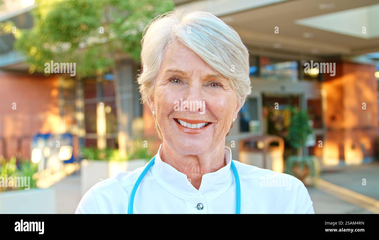 Portrait Of Senior Female Doctor With Stethoscope At Work Standing ...