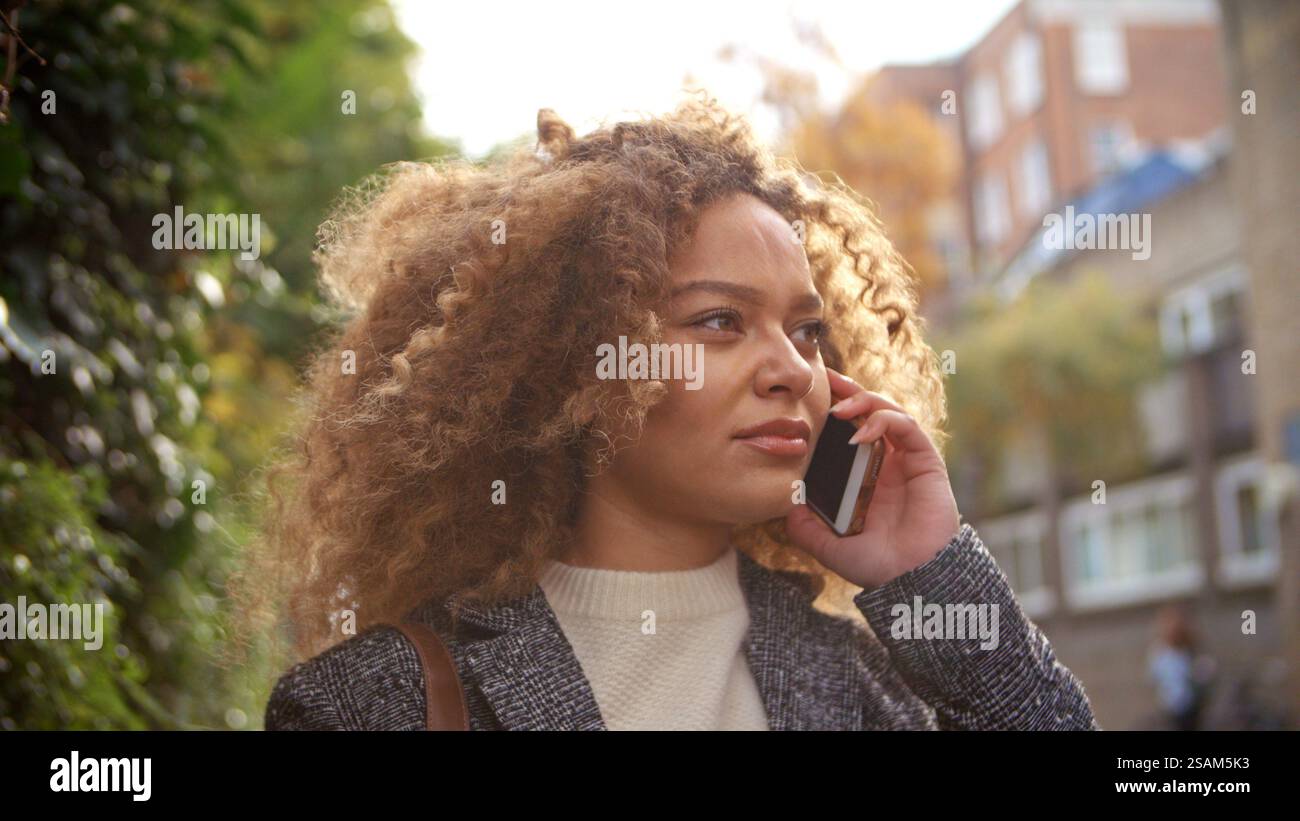 Close Up Of Stylish Young Woman Making Call Using Mobile Phone On City ...
