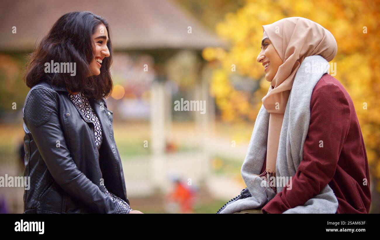 Muslim woman and british woman talking hi-res stock photography and ...