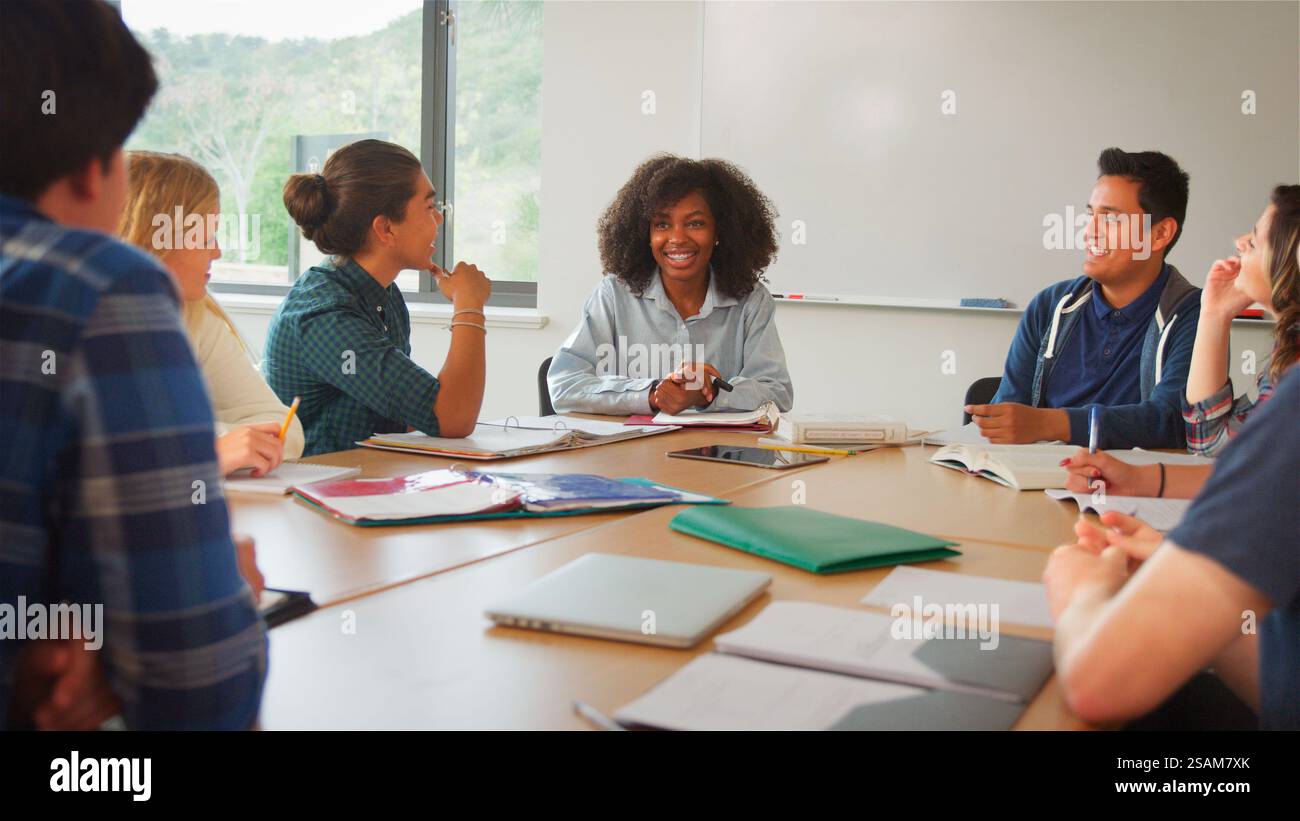 Female Tutor Teaching Class Of High School College Or University ...