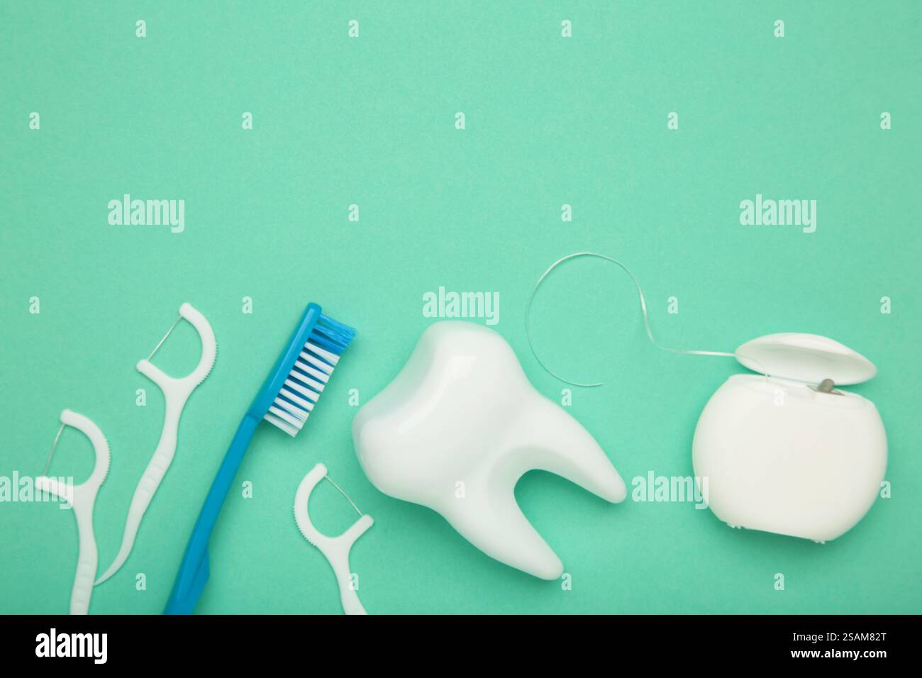White healthy tooth with dental floss. Oral dental care products ...