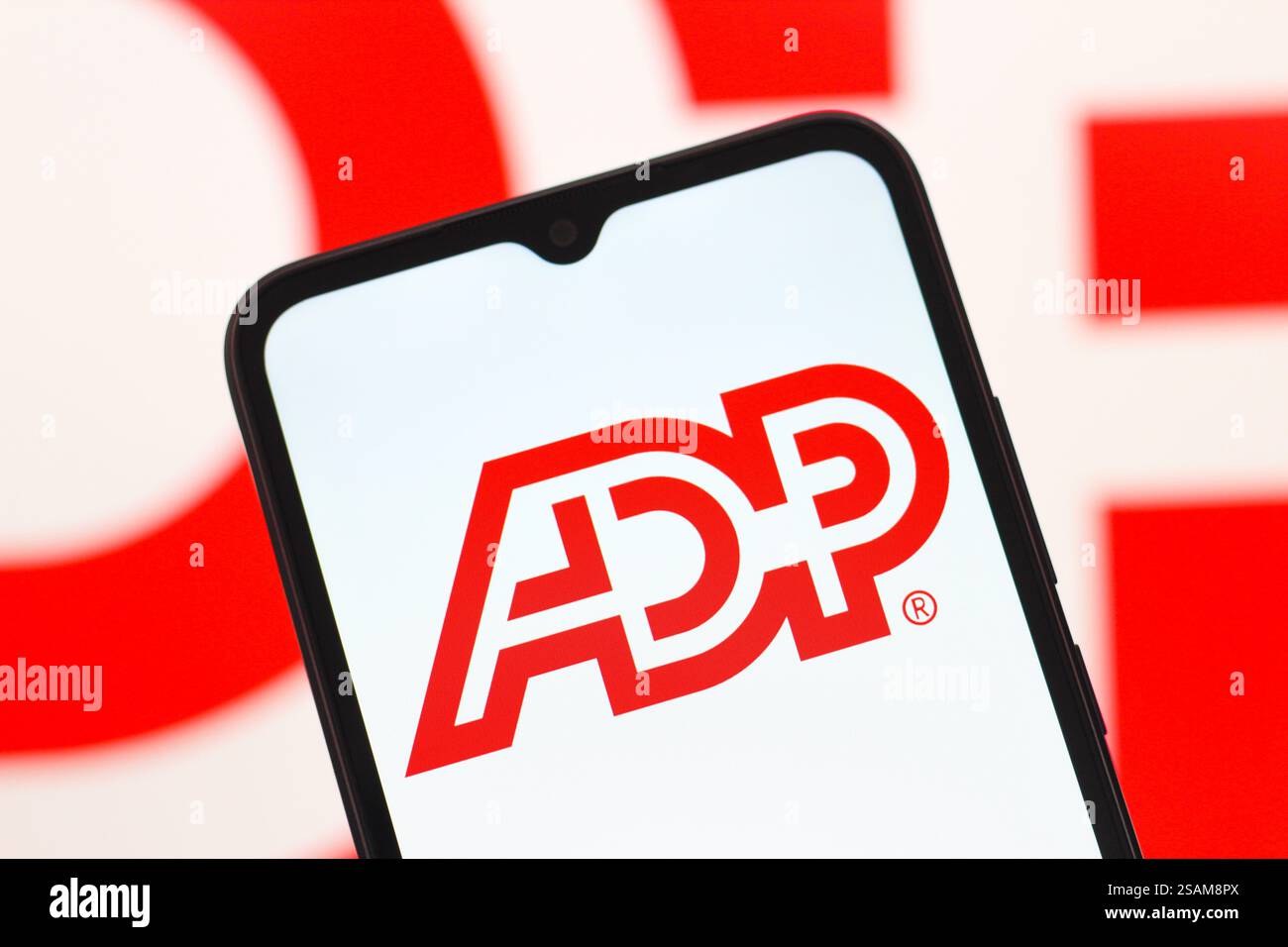 In this photo illustration, the Automatic Data Processing (ADP) logo is ...