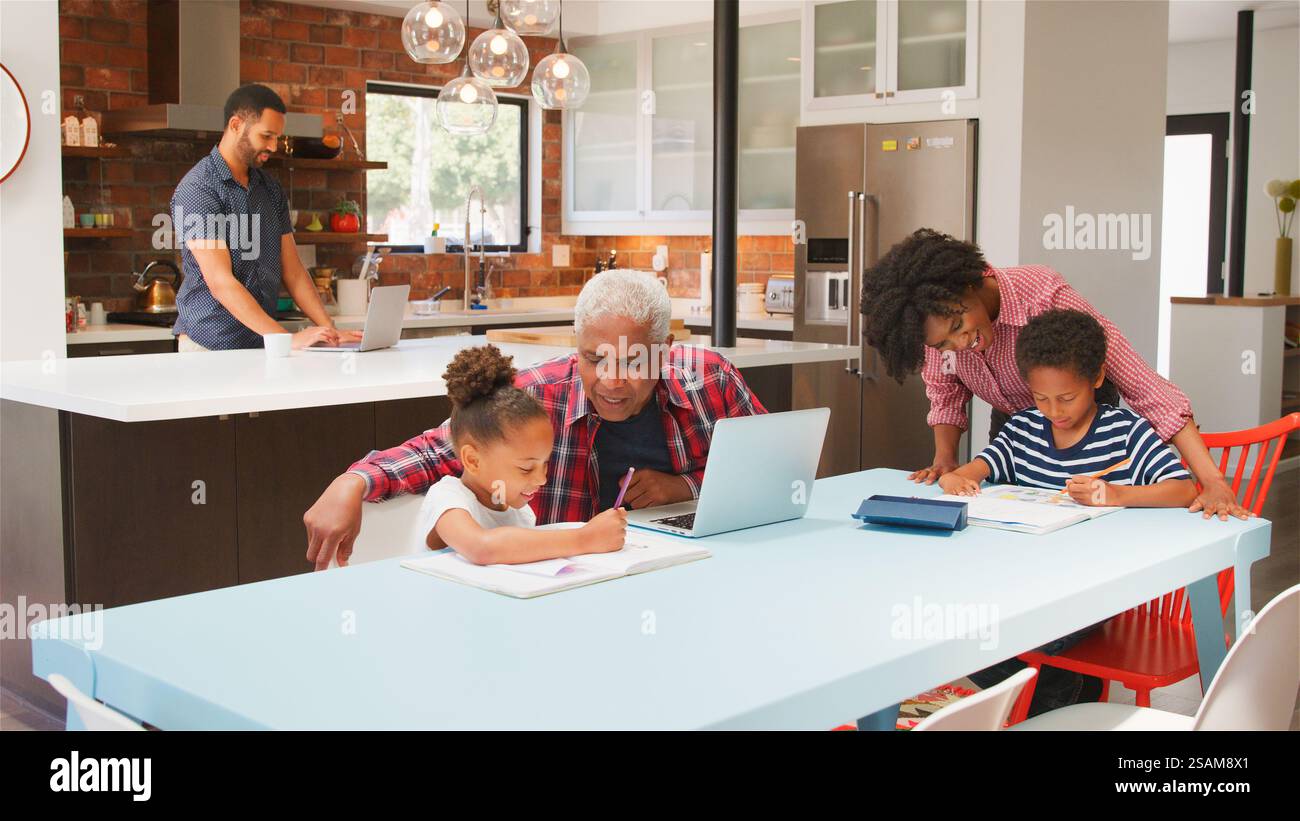 Children With Grandparents Doing Homework In Busy Multi Generation ...