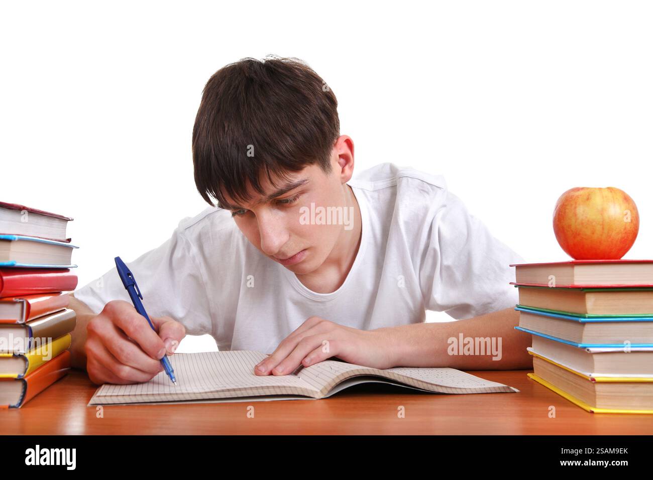 Student writing at the School Desk Isolated on the White Background ...