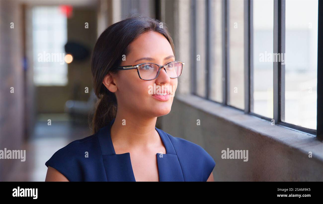 Head And Shoulders Portrait Of Confident Businesswoman Wearing Glasses ...