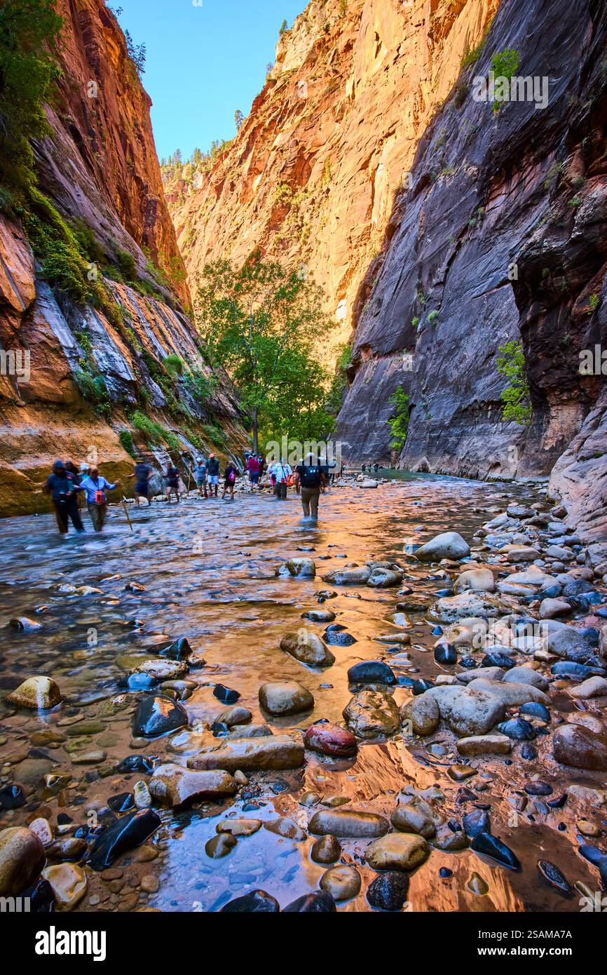 Hikers walking through river canyon hi-res stock photography and images ...