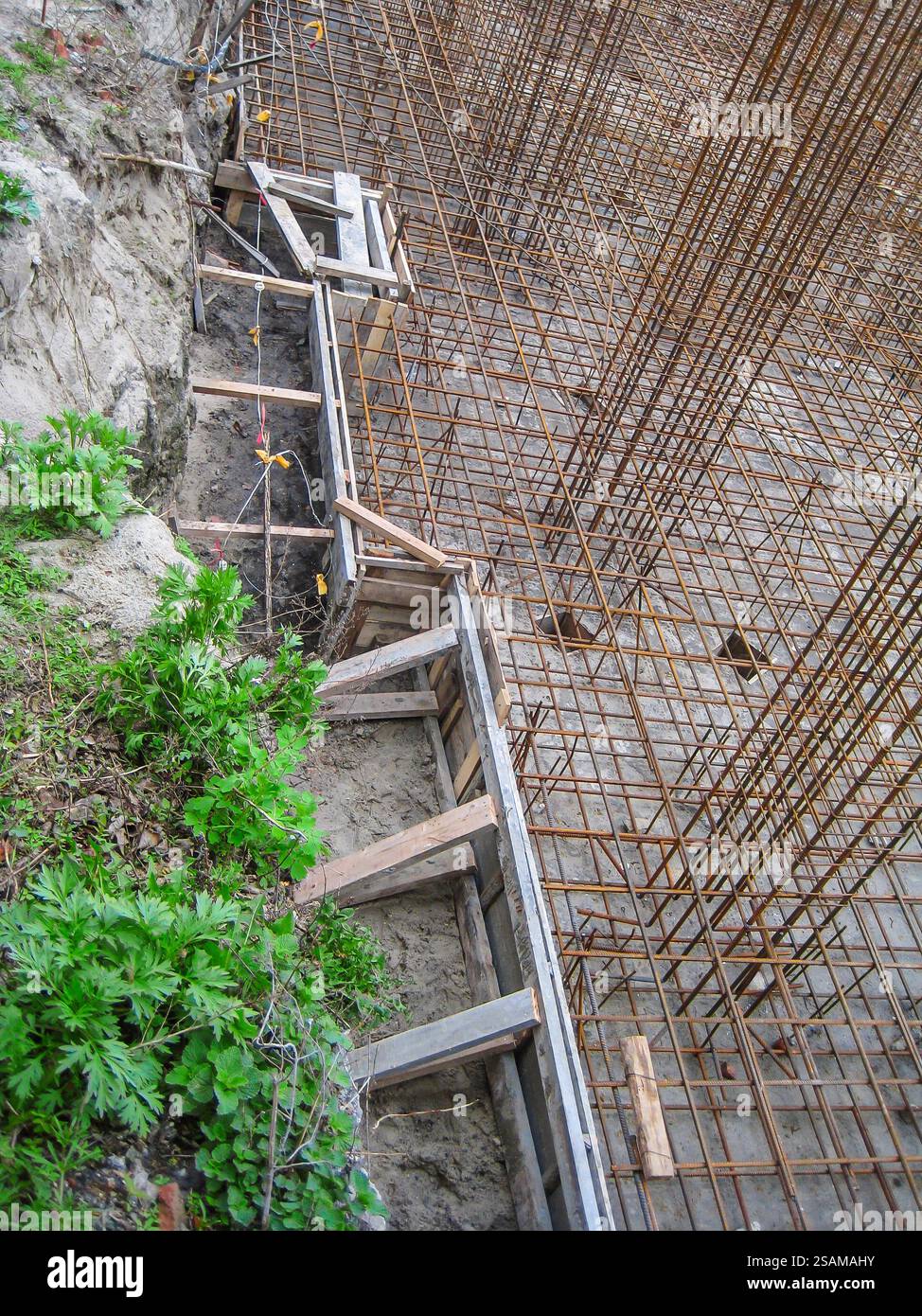Reinforced steel bars and formwork installed for a concrete foundation ...
