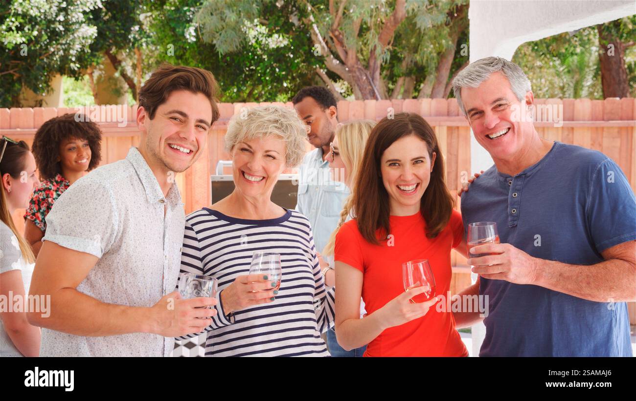 Portrait Of Family With Senior Parents And Adult Offspring Outdoors At ...
