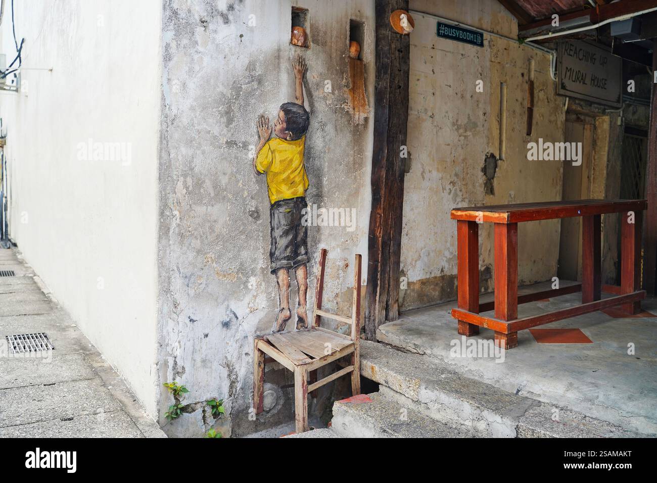 Boy reaching up - Famous street mural,Cannon Street by Lithuanian artist Ernest Zacharevic ...