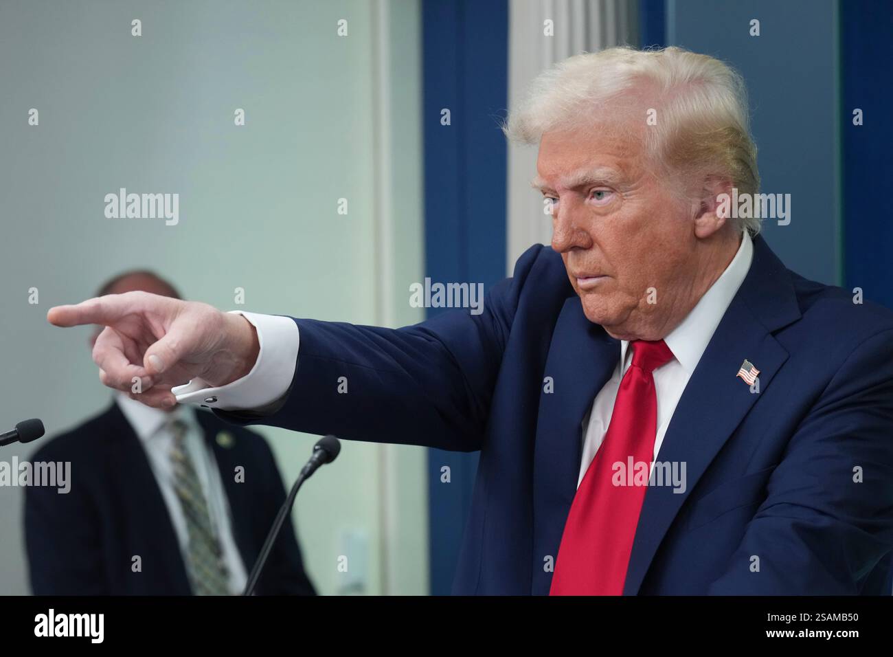President Donald Trump takes questions while speaking with reporters in ...