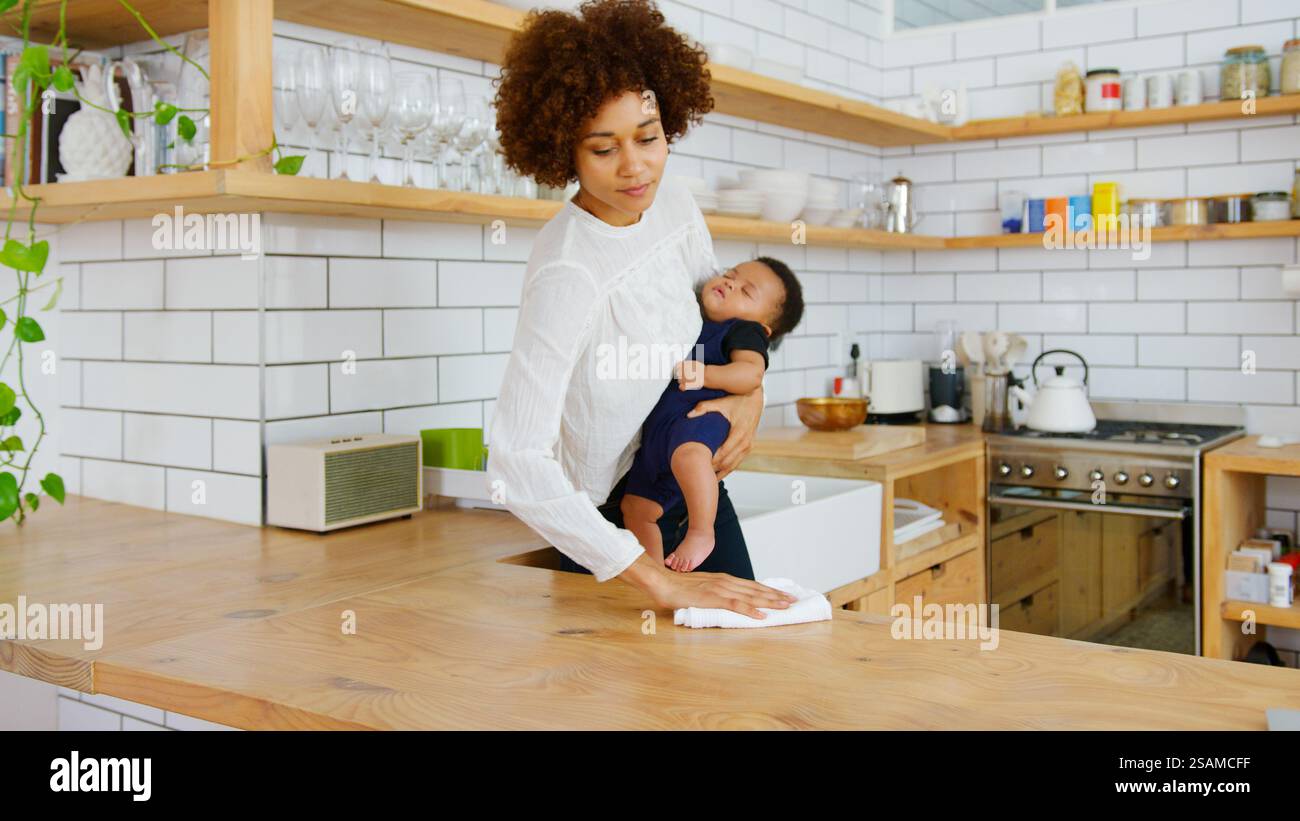 Old woman busy cleaning kitchen hi-res stock photography and images - Alamy
