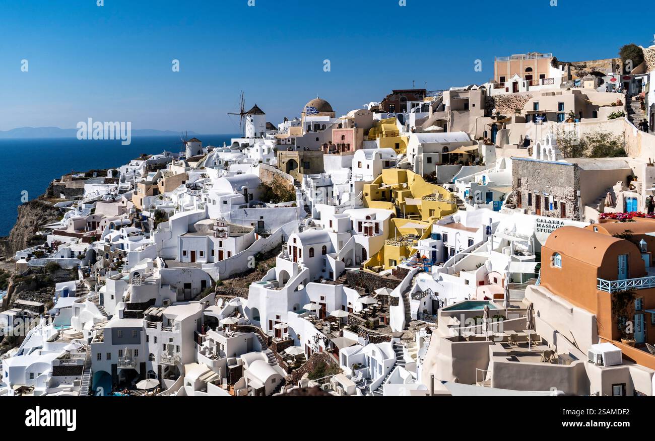 A panoramic view of the iconic white-washed buildings of Santorini ...