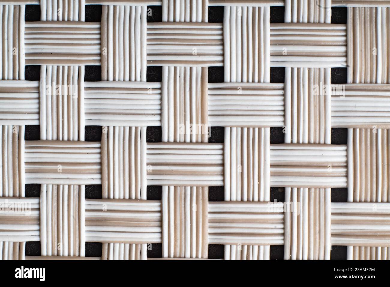 Detailed woven texture of a light-colored material in a grid pattern ...