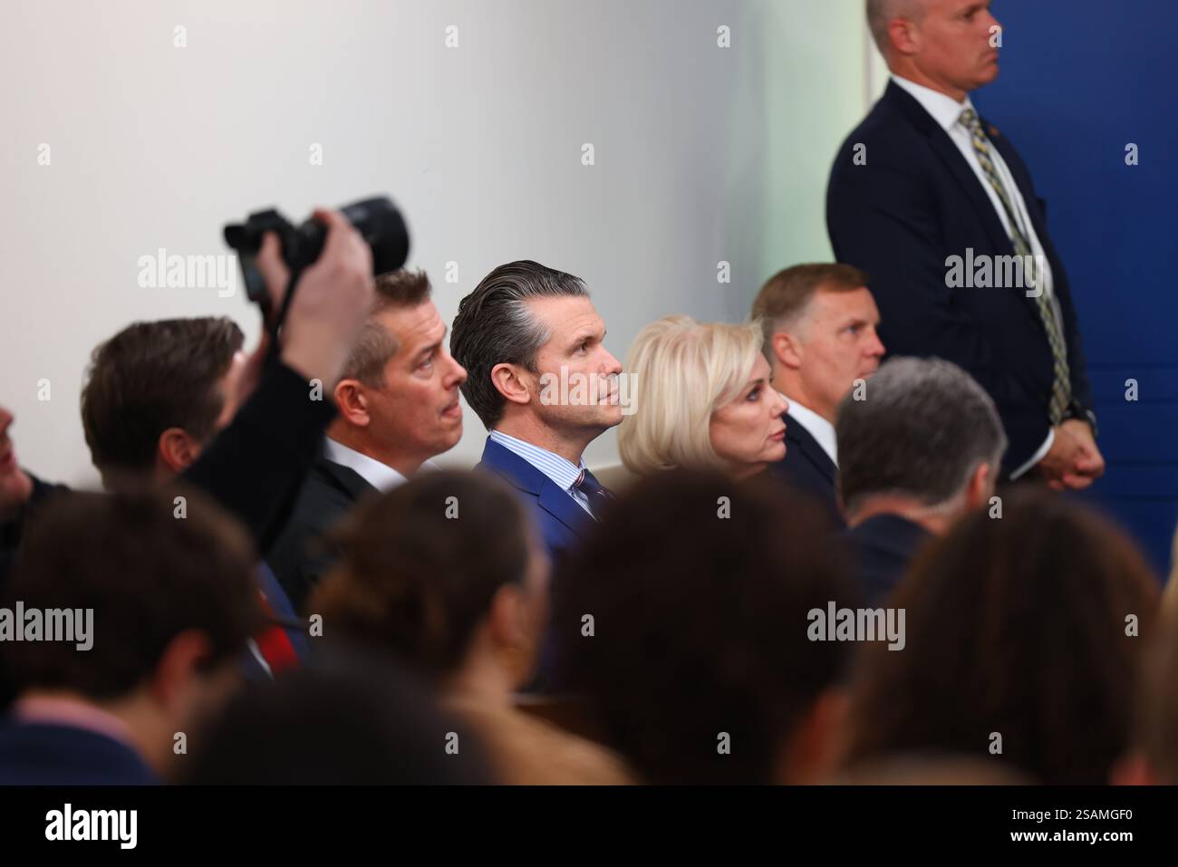 WASHINGTON –– Pete Hegseth watches President Donald Trump speak at a ...