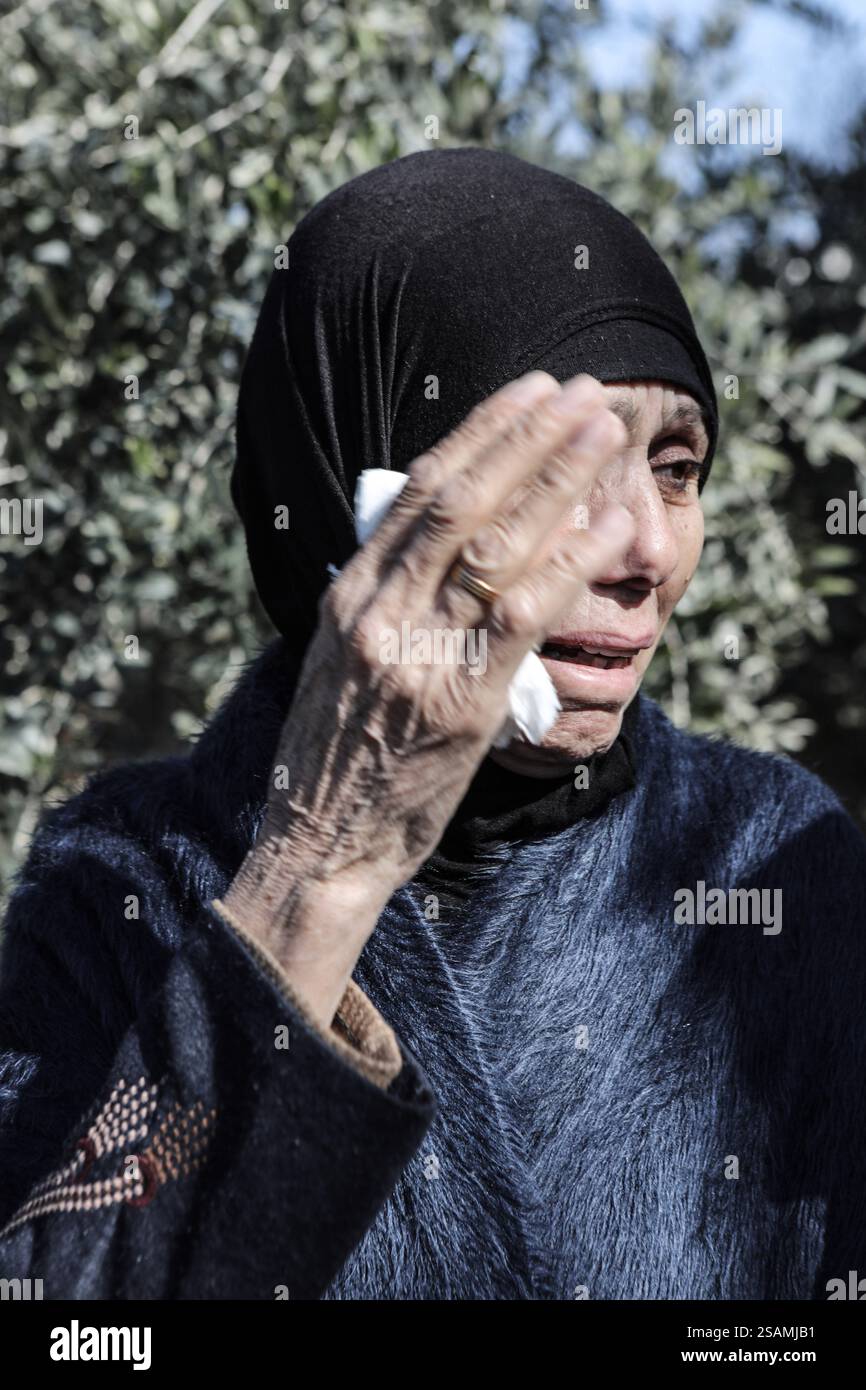 Palestinian relative mourns during the funeral ceremony of Ibrahim and ...