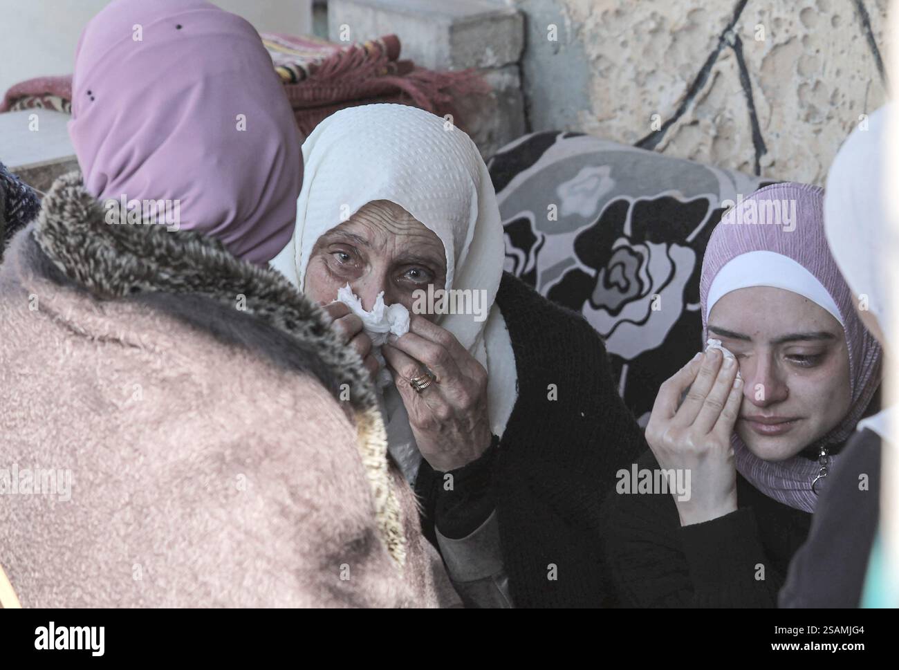 A grandmother of Ibrahim and Mohammed Bani Odeh cries during their ...