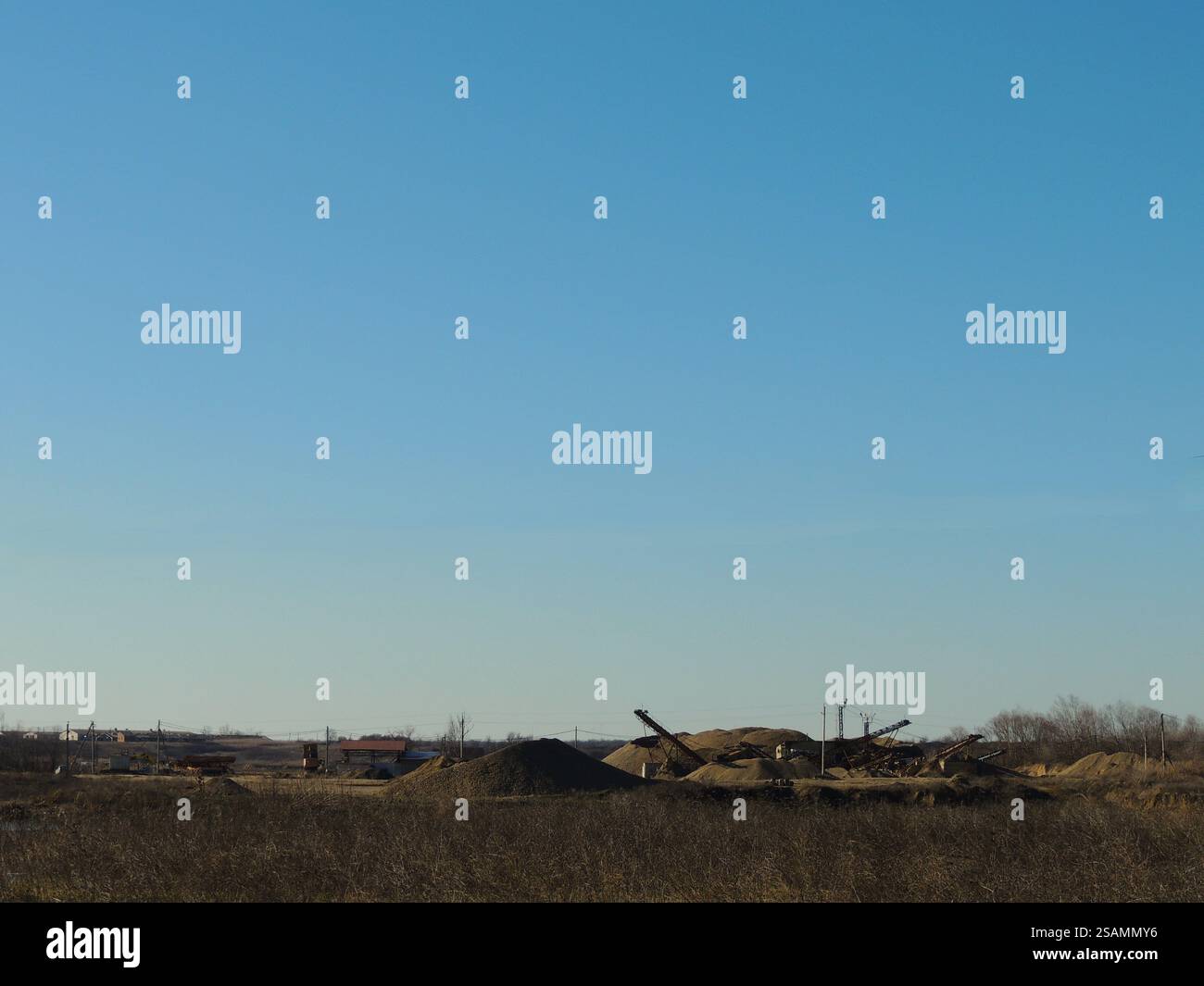 mining and crushing of natural stone on open flat terrain, piles of ...