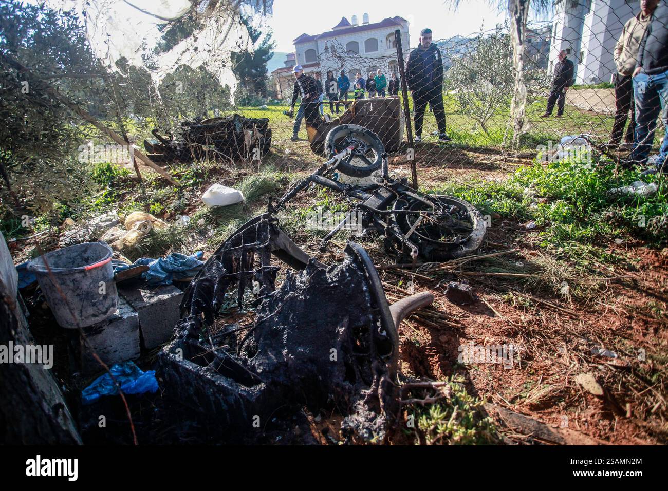 Tubas, Palestine. 30th Jan, 2025. Palestinians inspect the site of an ...