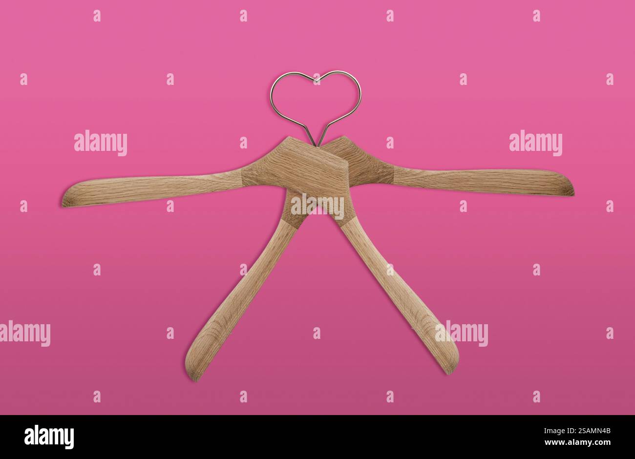 Coat hanger with heart Stock Photo - Alamy