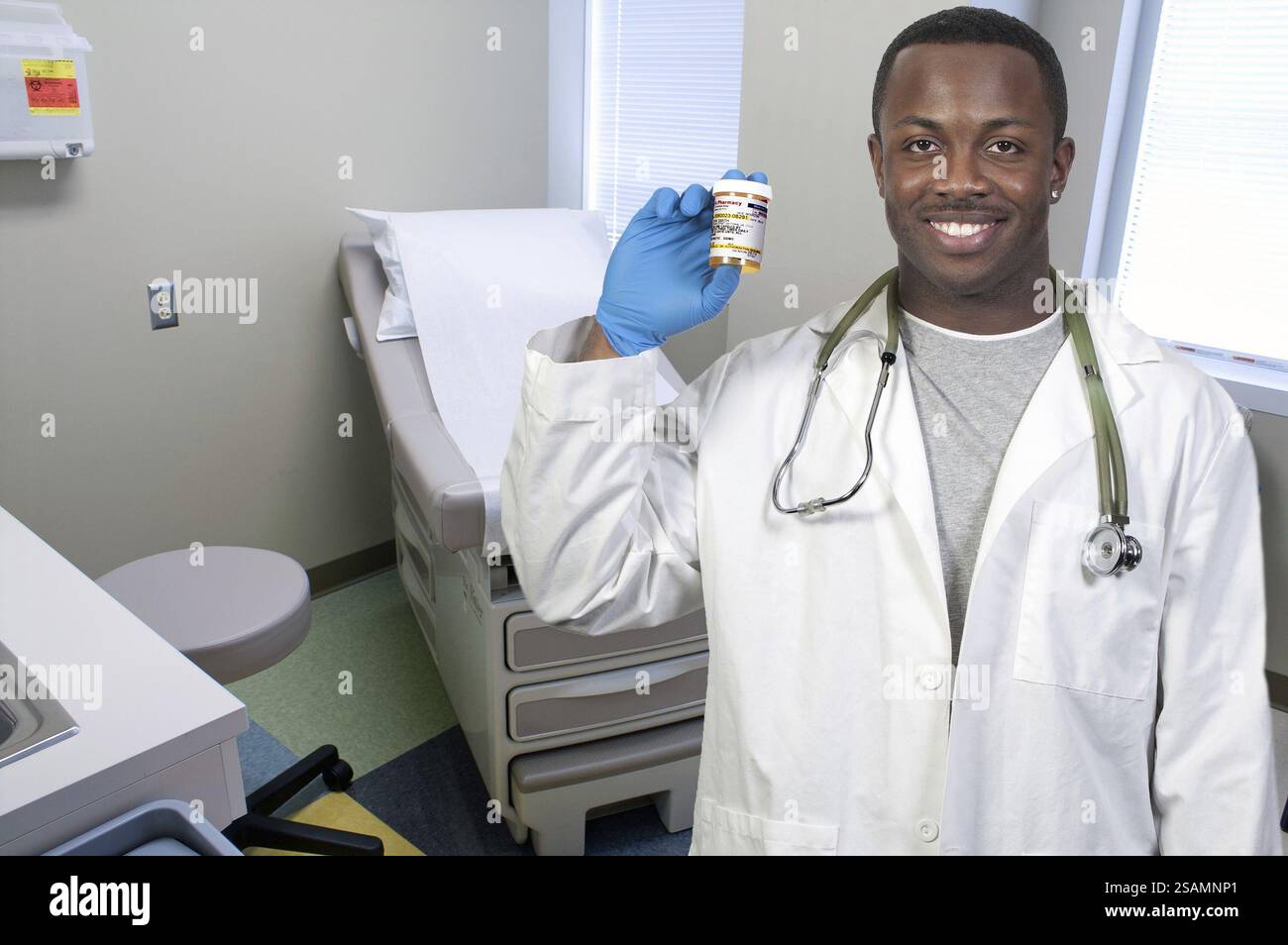 Black man African American holding a prescription medication pill ...