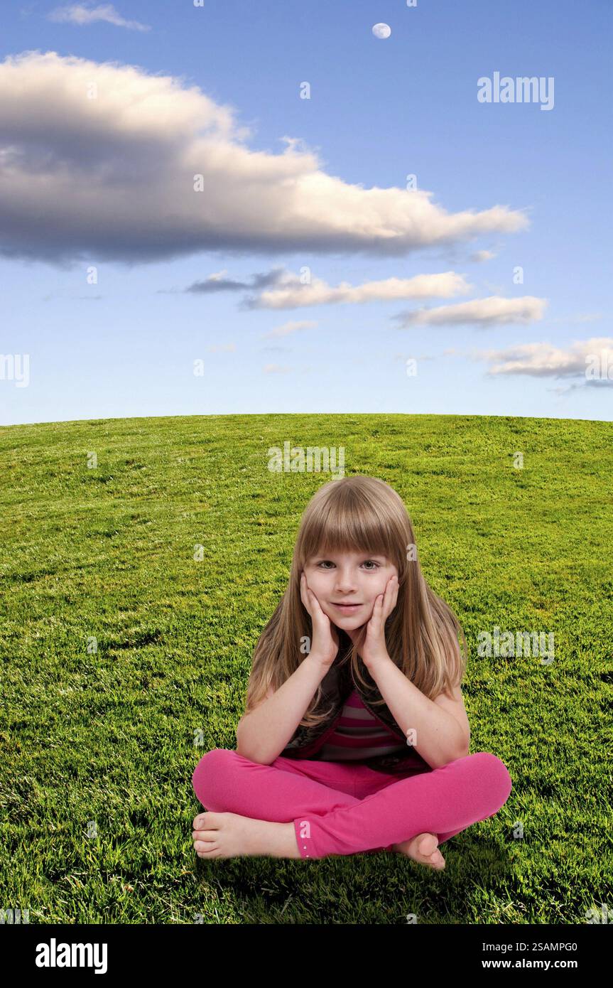 Beautiful little girl sitting with her legs crossed Stock Photo - Alamy