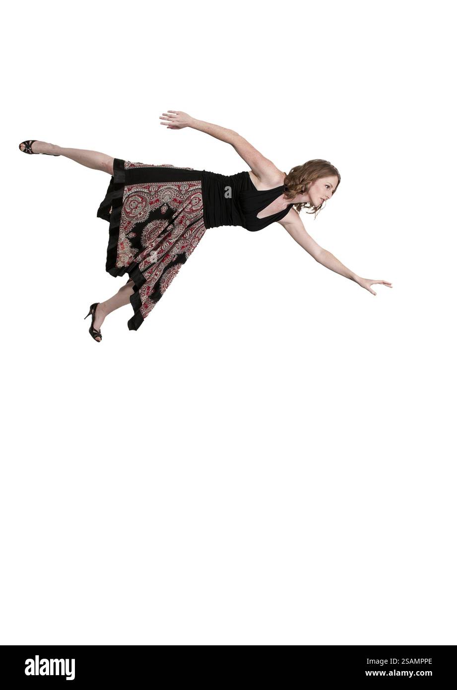 A beautiful young actress dancer flying through the sky or falling ...