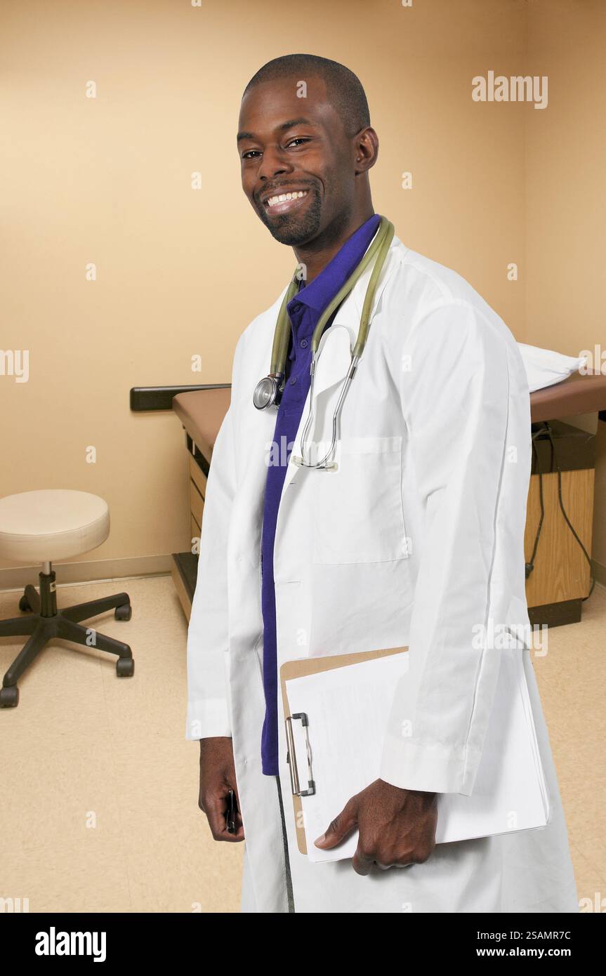 African American black man doctor holding a clipboard with a patient ...