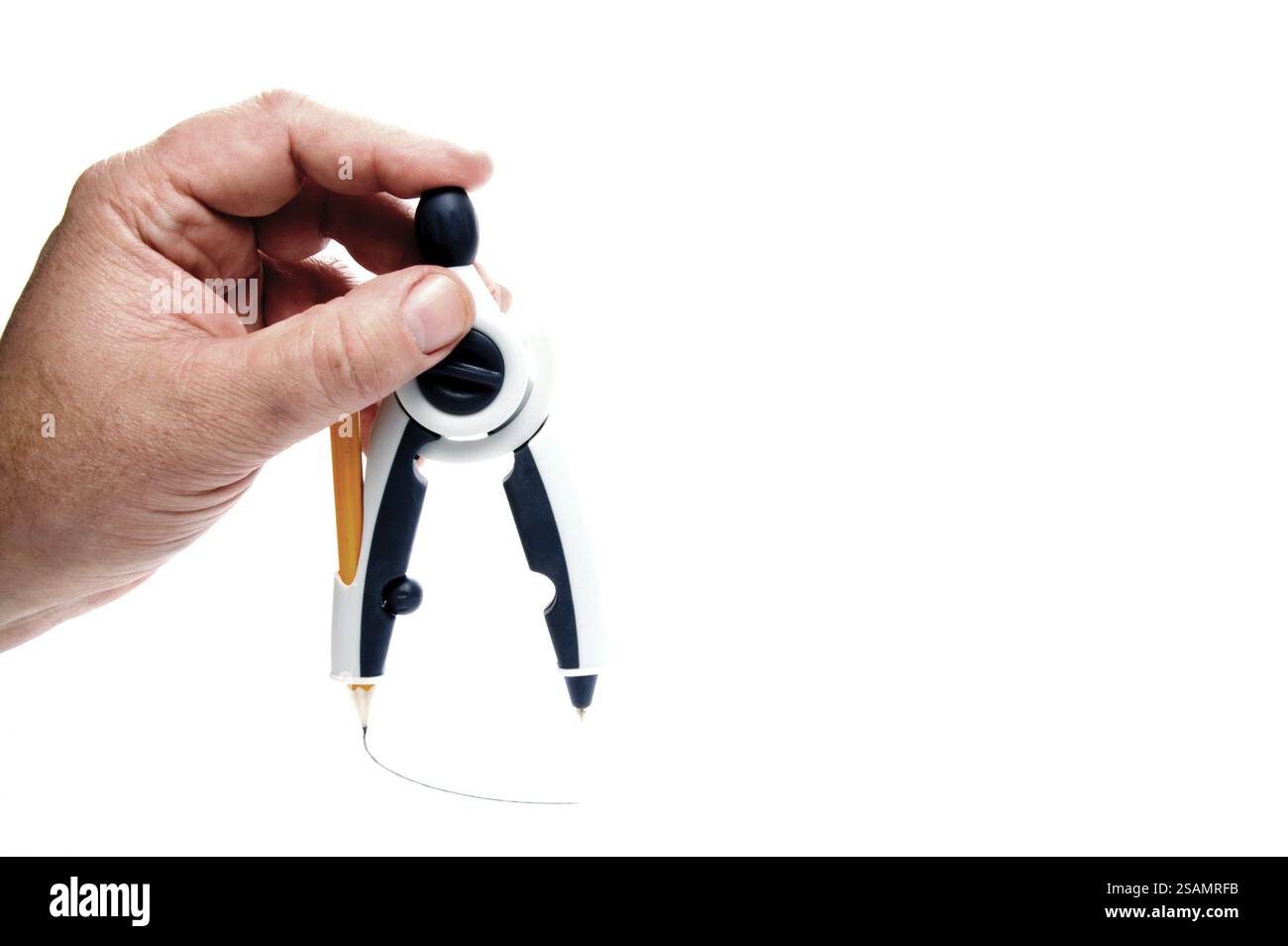 A person using a compass for geometry Stock Photo - Alamy
